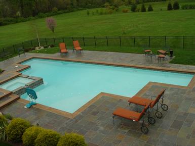 slate pool deck with stamped concrete coping from Paradise Stone & Tile ...