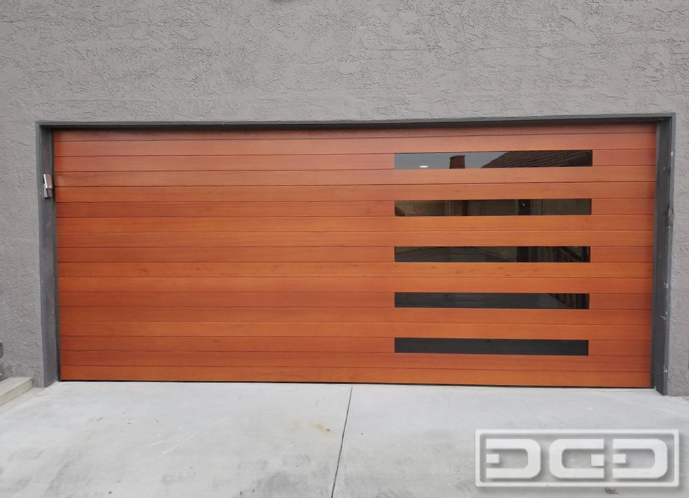 Modern Style Garage Door With Asymmetrical Dark Tinted Windows from ...